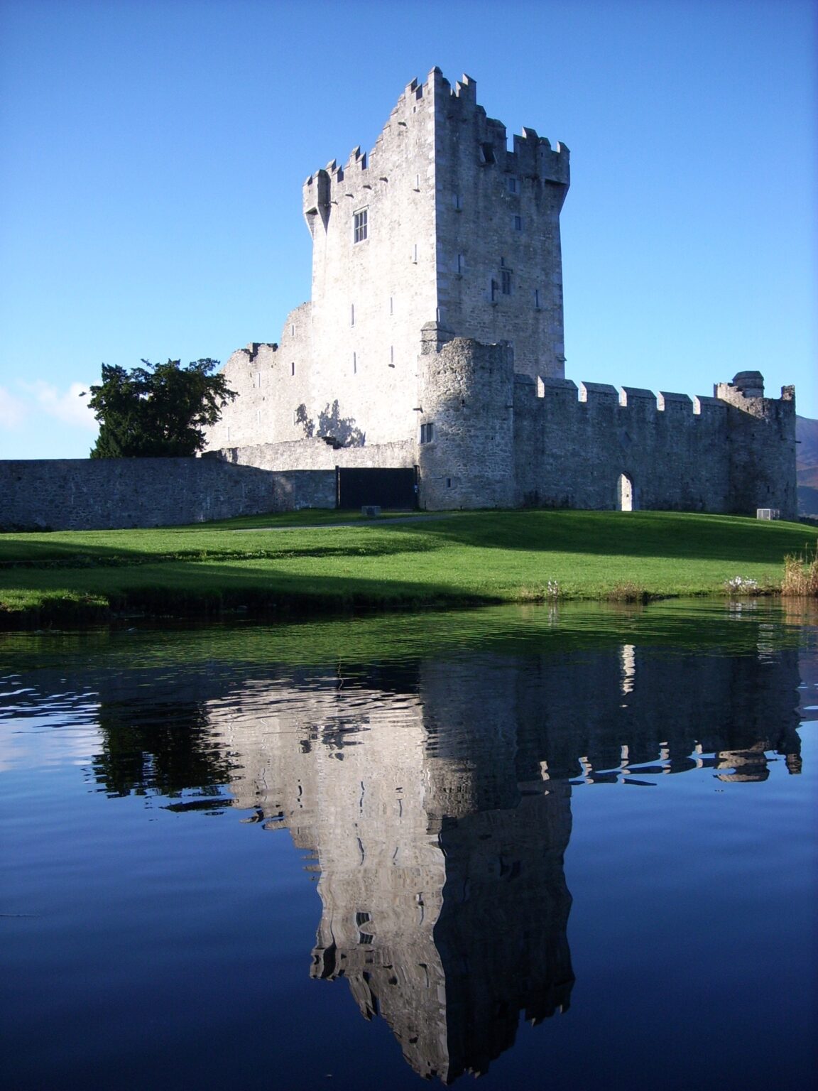 Kayaking Past Ross Castle In Killarney National Park - Outdoors Ireland